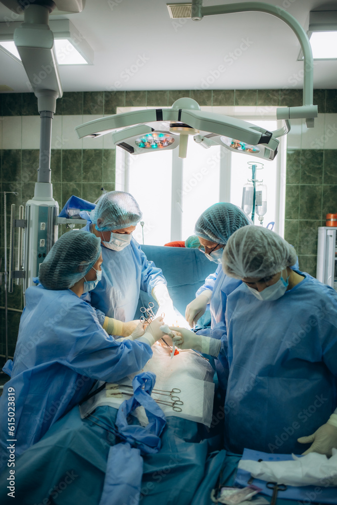 Surgical team performing surgery operation. Doctor performing surgery ...