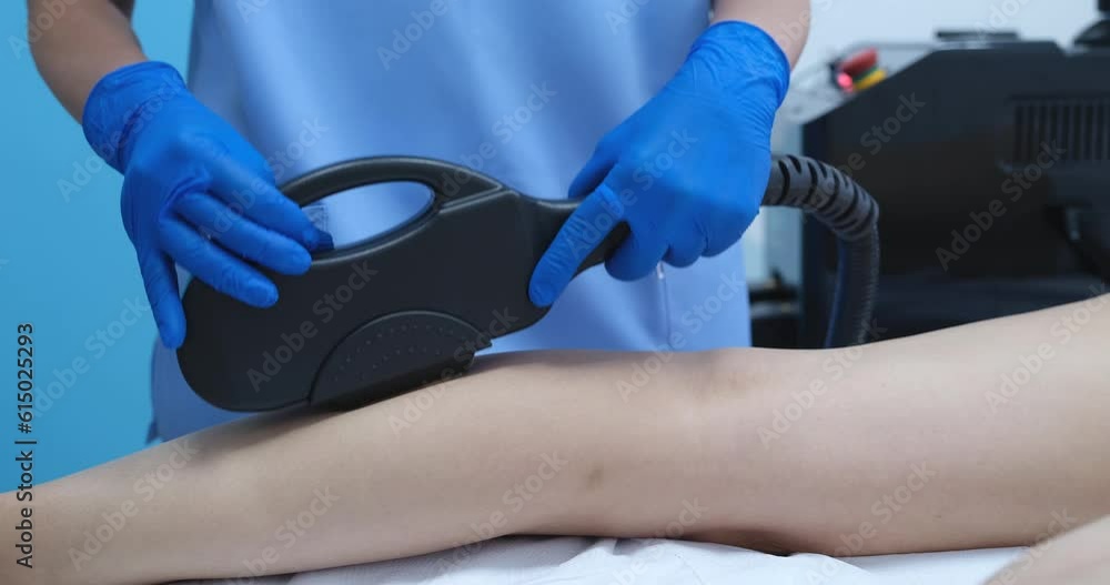 Hands with equipment for laser depilation of legs closeup. Types of ...