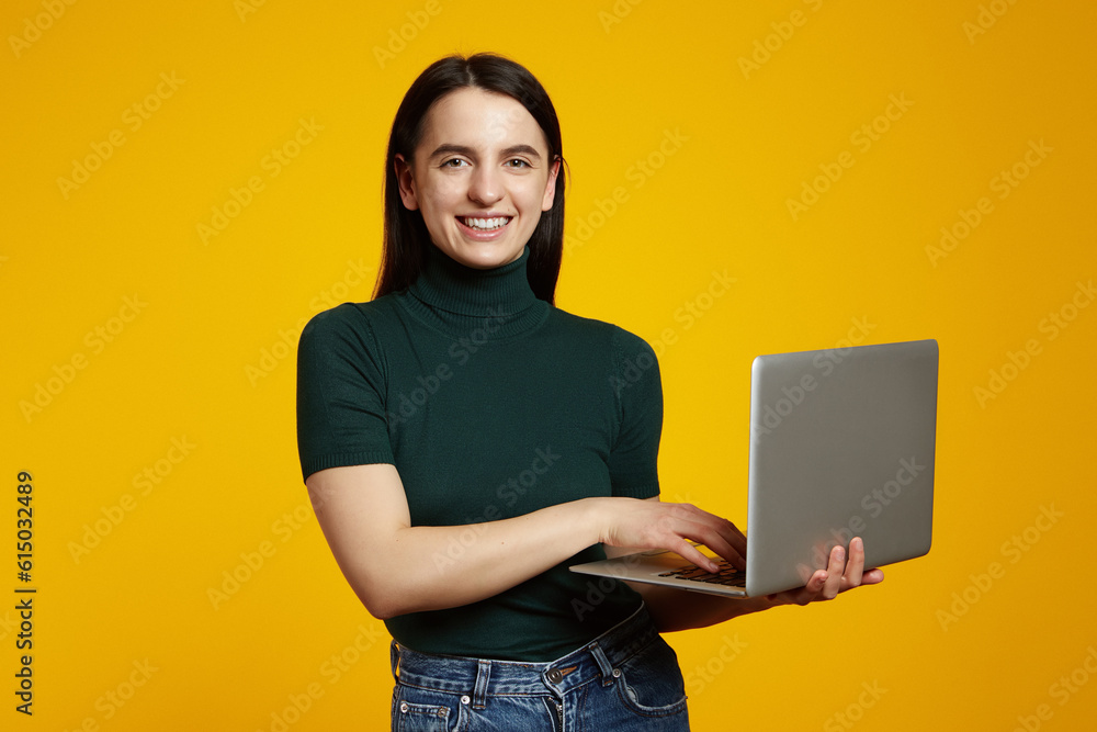 Portrait of a happy caucasian student girl study on laptop computer ...