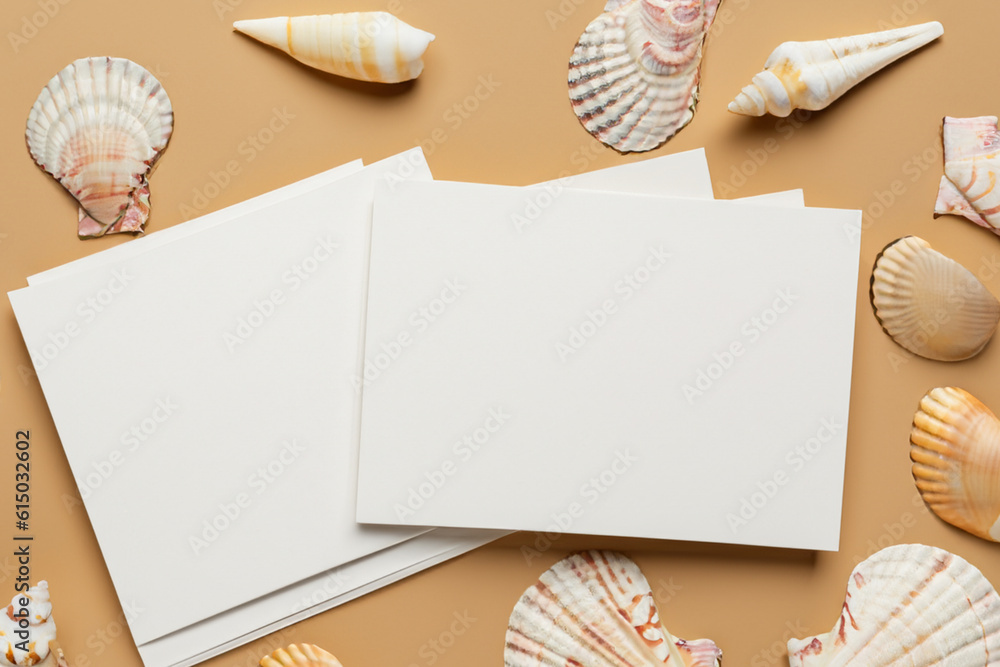 Gently beige background, white paper cards A4, A6, business cards and ...