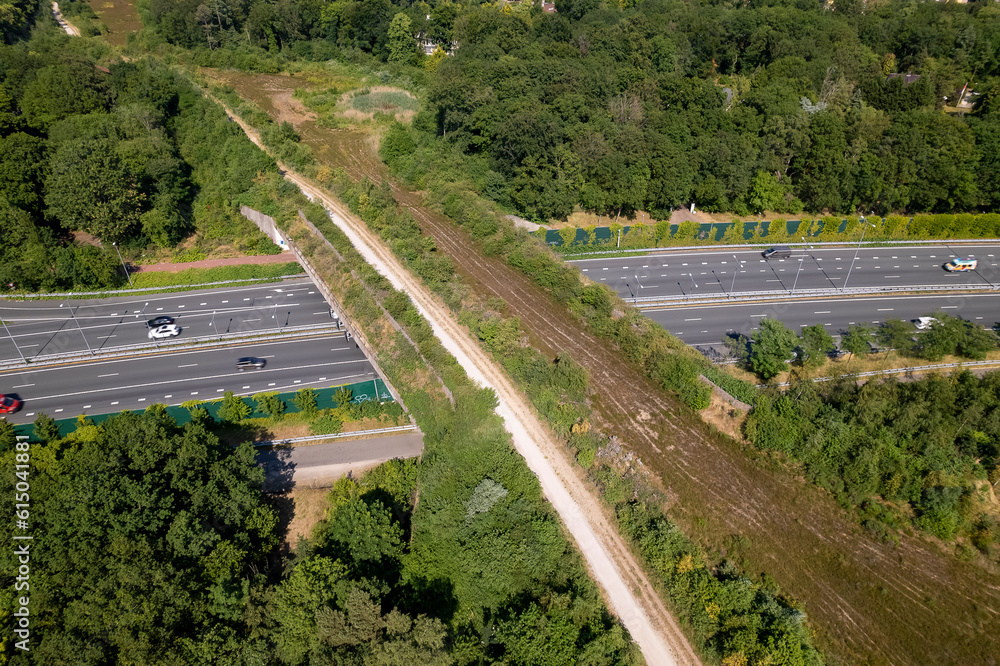 Interstate freeway with wildlife crossing green corridor bridge for ...