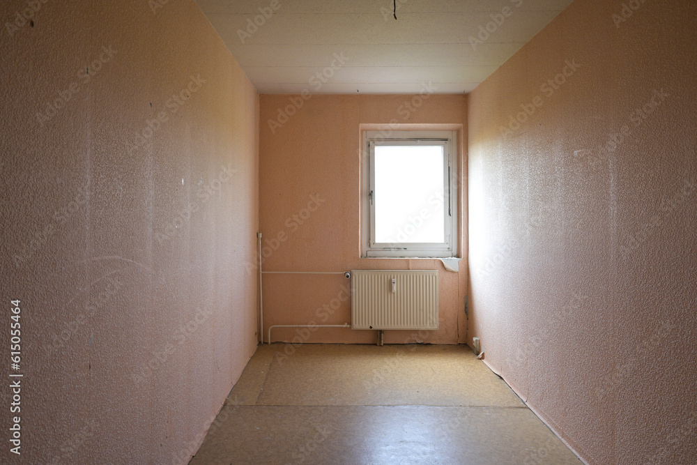 Cramped unrenovated room intended as enough space in a typical rental ...