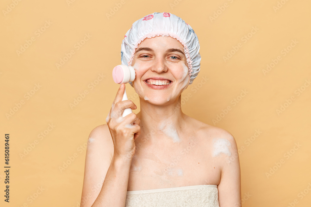 Facial beauty treatment. Beautiful smiling happy woman washing face ...
