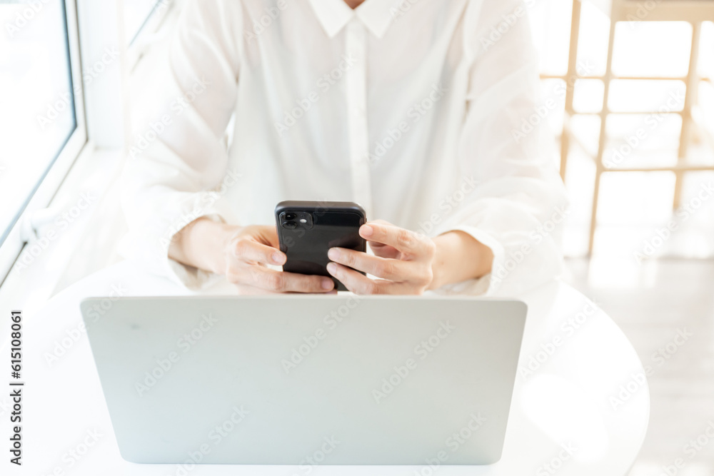 woman work using texting cell phone typing computer.student study ...