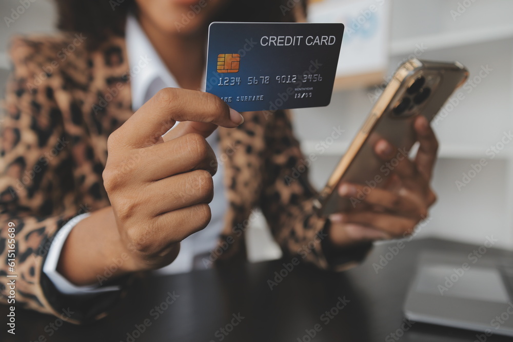 Women holding credit card and using smartphones at home.Online shopping ...