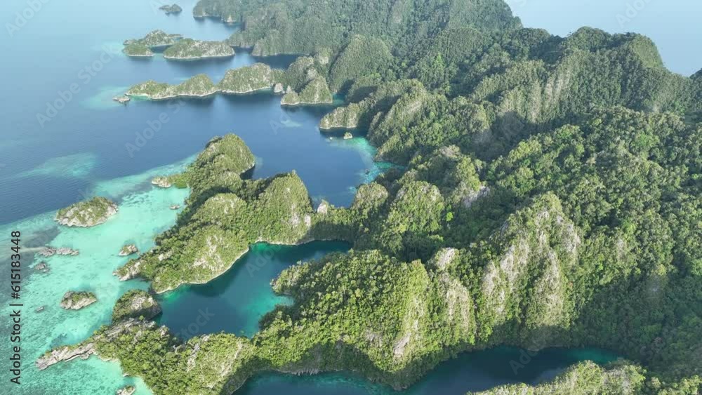 Dramatic limestone islands, eroded over millions of years, rise from ...