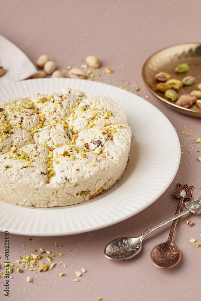 Plate of tasty Tahini halva with pistachios on beige background, closeup Stock Photo | Adobe Stock