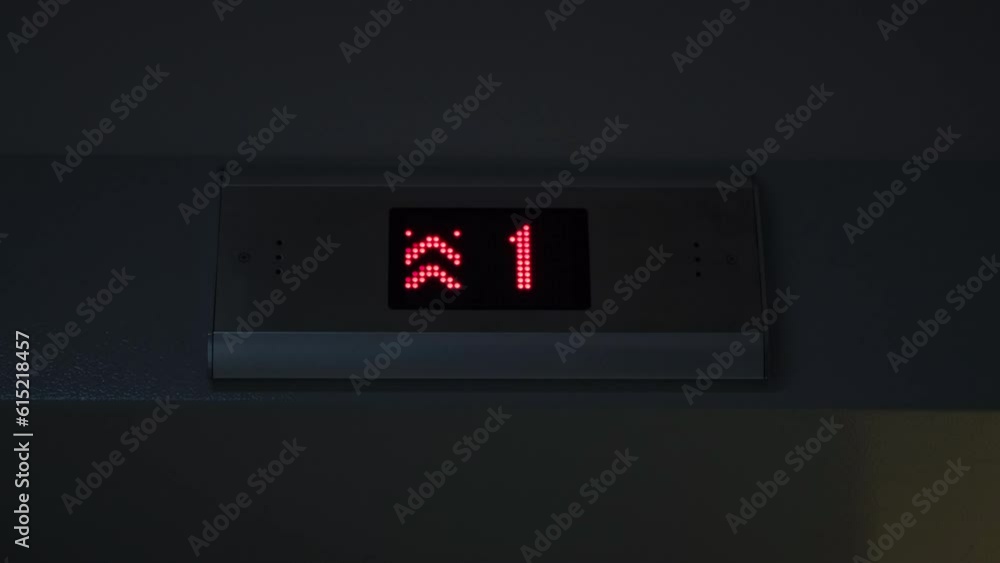 Display of an elevator going up indicating the floor number passing ...