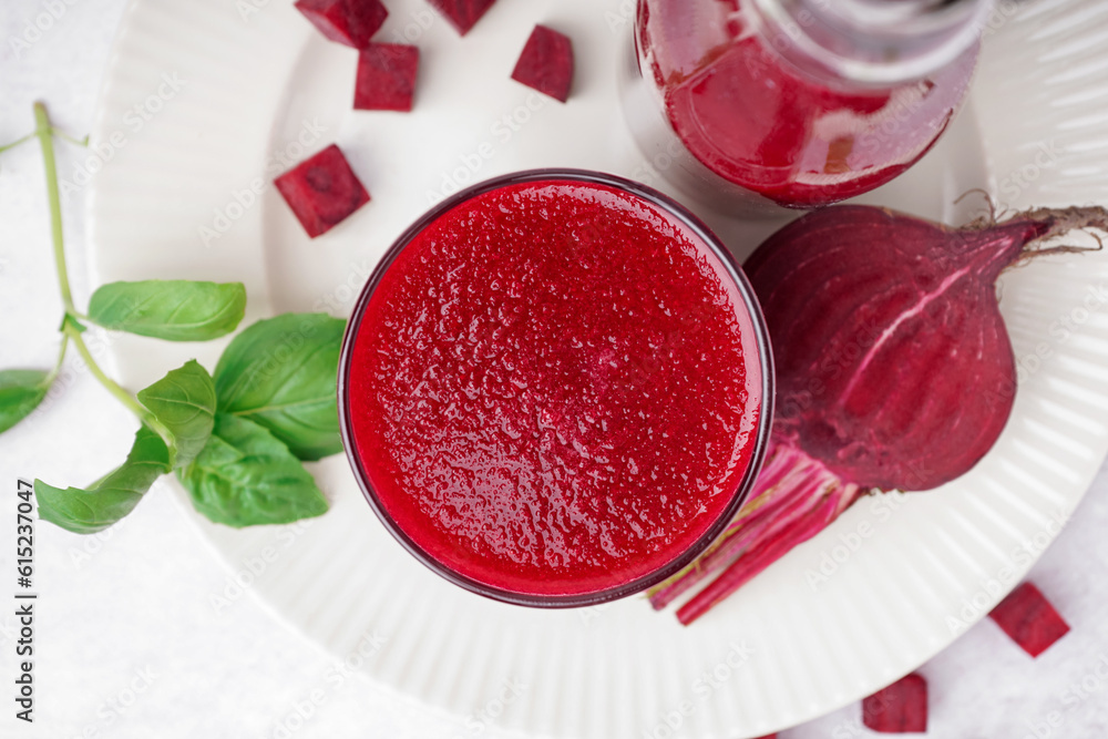 Glass of fresh beetroot juice on light background Stock Photo | Adobe Stock