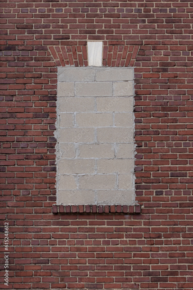 Foto de window sealed with cinderblocks on a red brick wall, with a ...