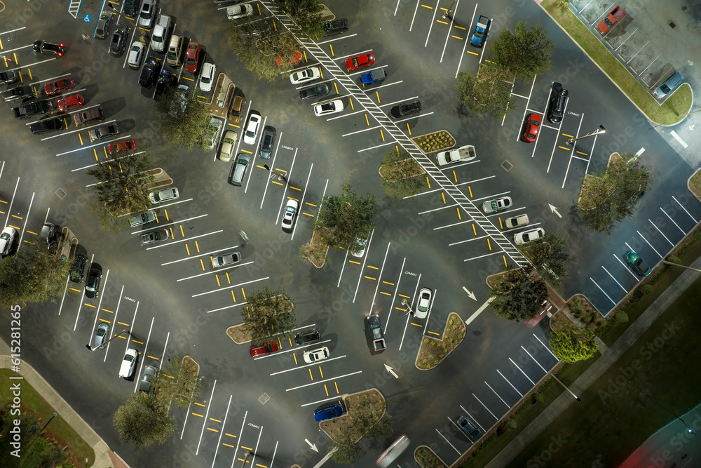 View from above of many parked cars on illuminaded parking lot with ...