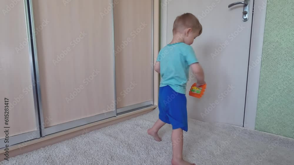 Cheerful little child is spinning at home. Copy space - concept of ...