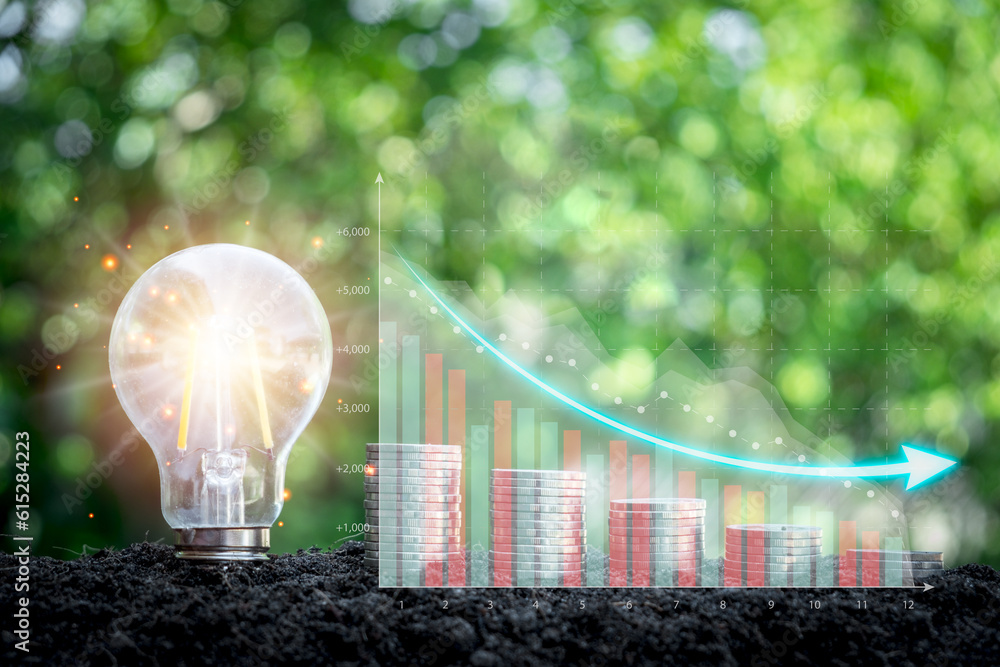 Cost reduction business finance concept, Light bulb on soil with graph ...