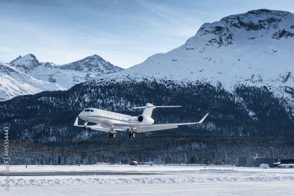 Luxury private jet approaching the engadin valley in the Swiss alps ...