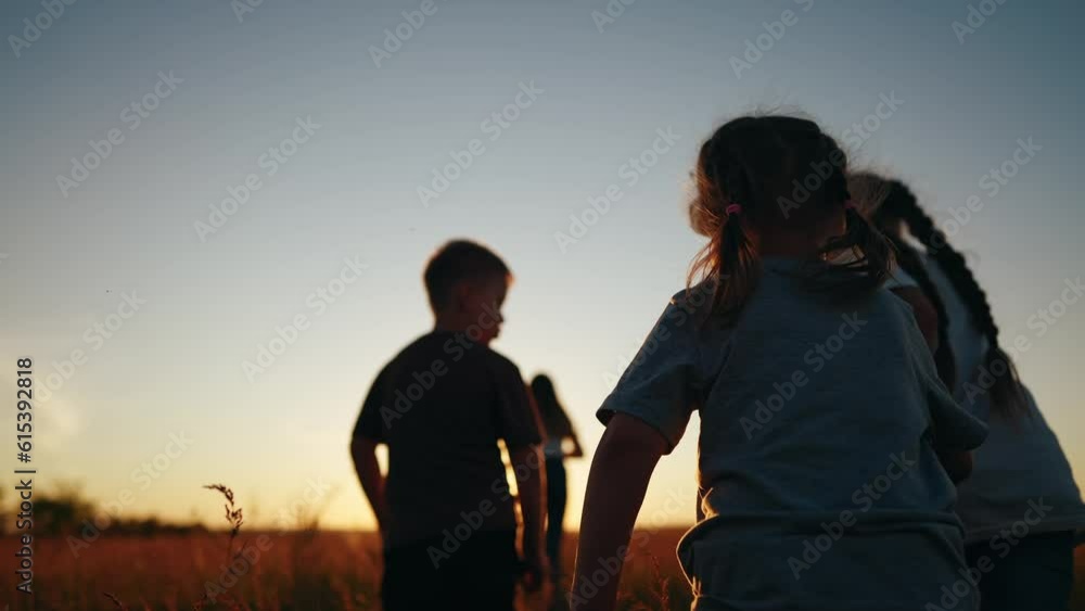 Children running in park at sunset. happy family kindergarten kids ...