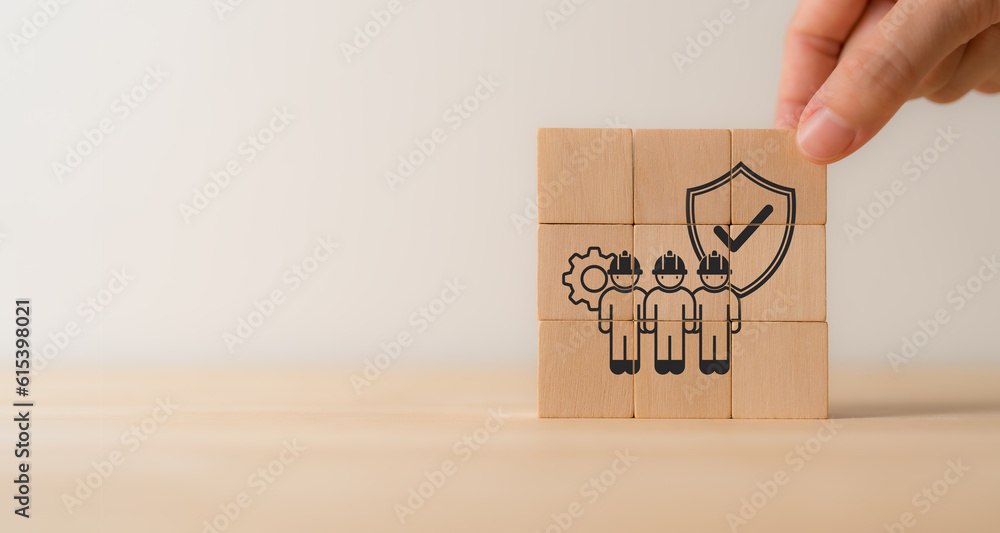 Work safety concept. Wooden cube blocks with icon of safety at ...