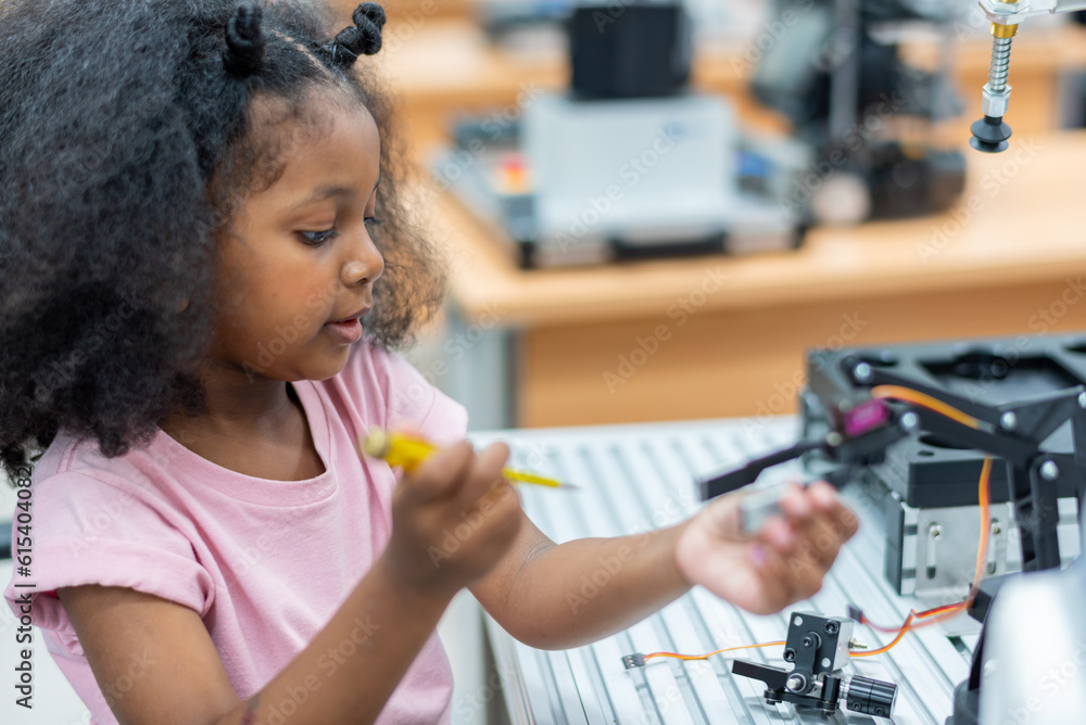 girl female teen children concentrate look Machine Learning Robot is ...