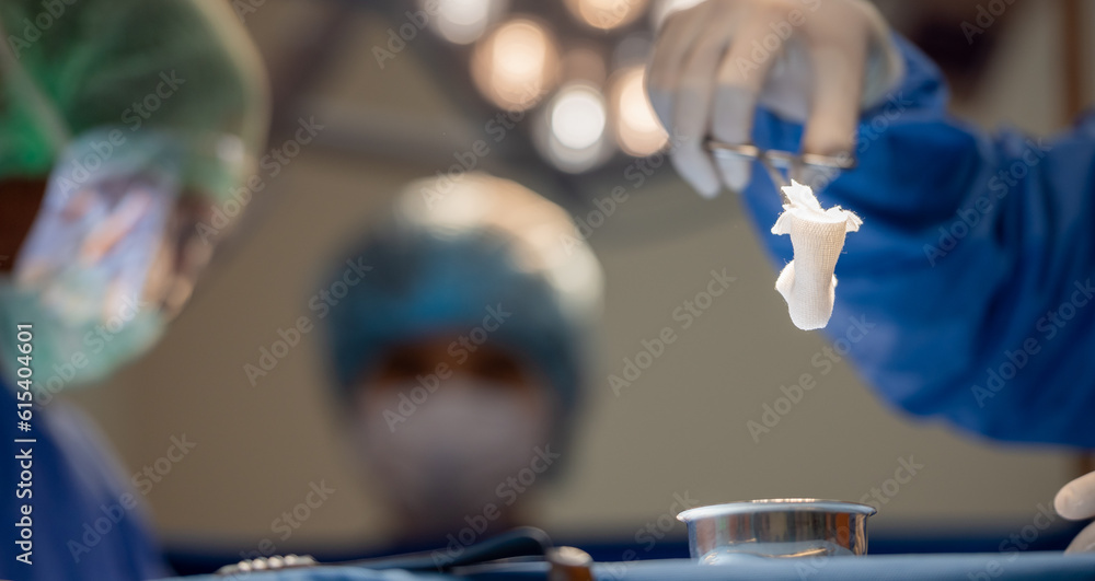 Hand of surgery doctor in Operating Room hold operating plier forceps ...
