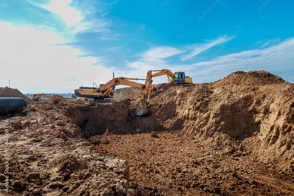 Two Excavator are digging soil in the construction site on sky ...
