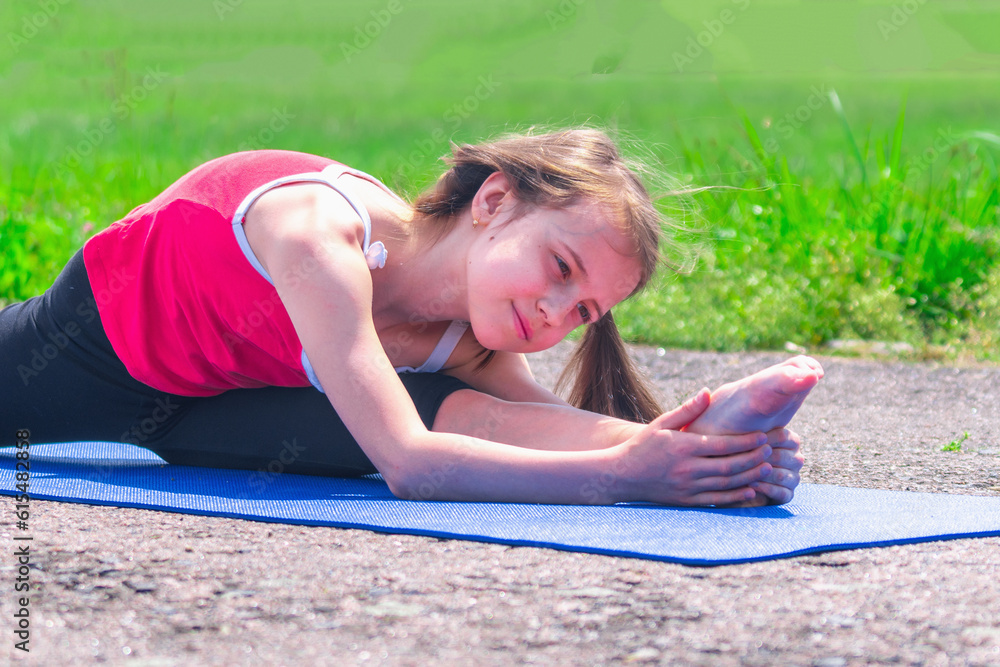 Stretching close up foot. Young sporty attractive girl doing split ...