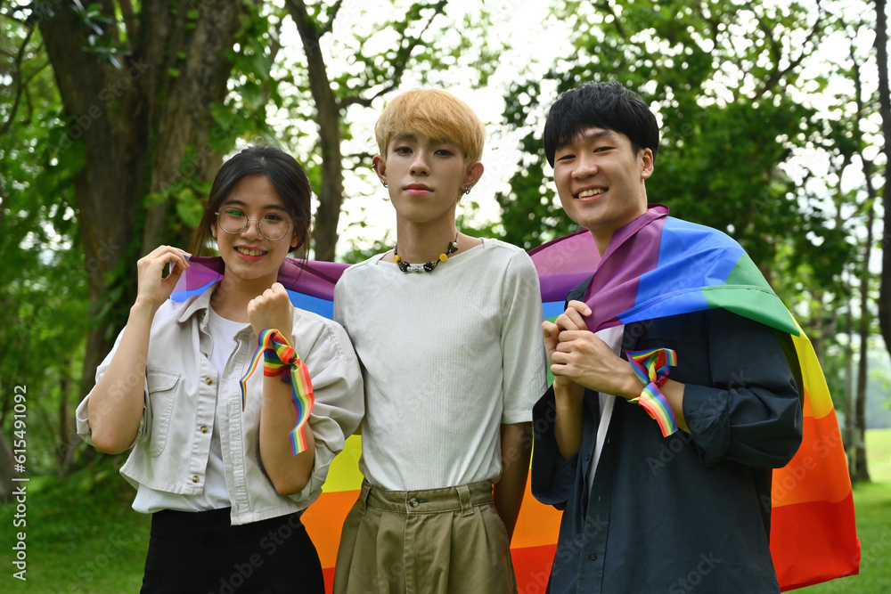 Celebrate Pride Month of young LGBT teenage people standing proudly ...