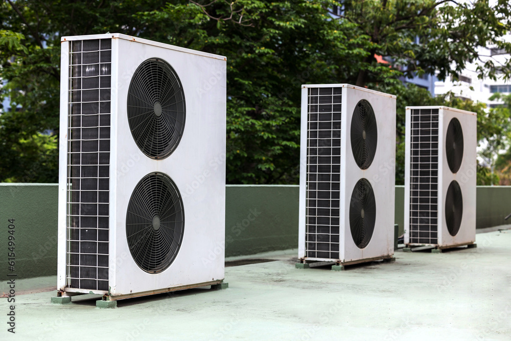 Air conditioner compressor installed in old building. Outdoor split ...