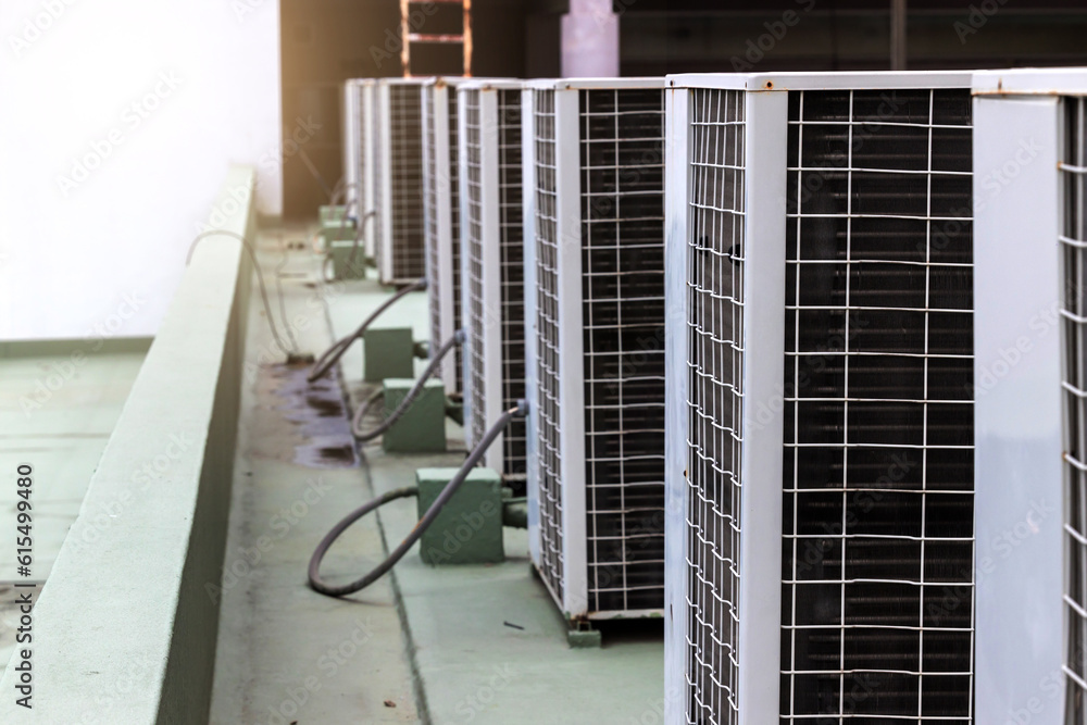 Air conditioner compressor installed in old building. Outdoor split ...