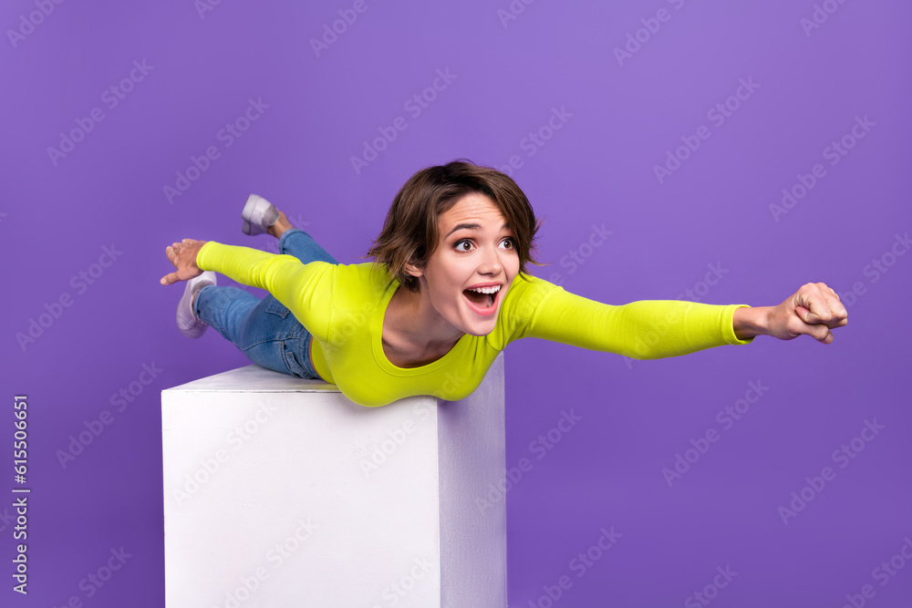 Full length portrait of overjoyed nice supergirl raise hand forward ...