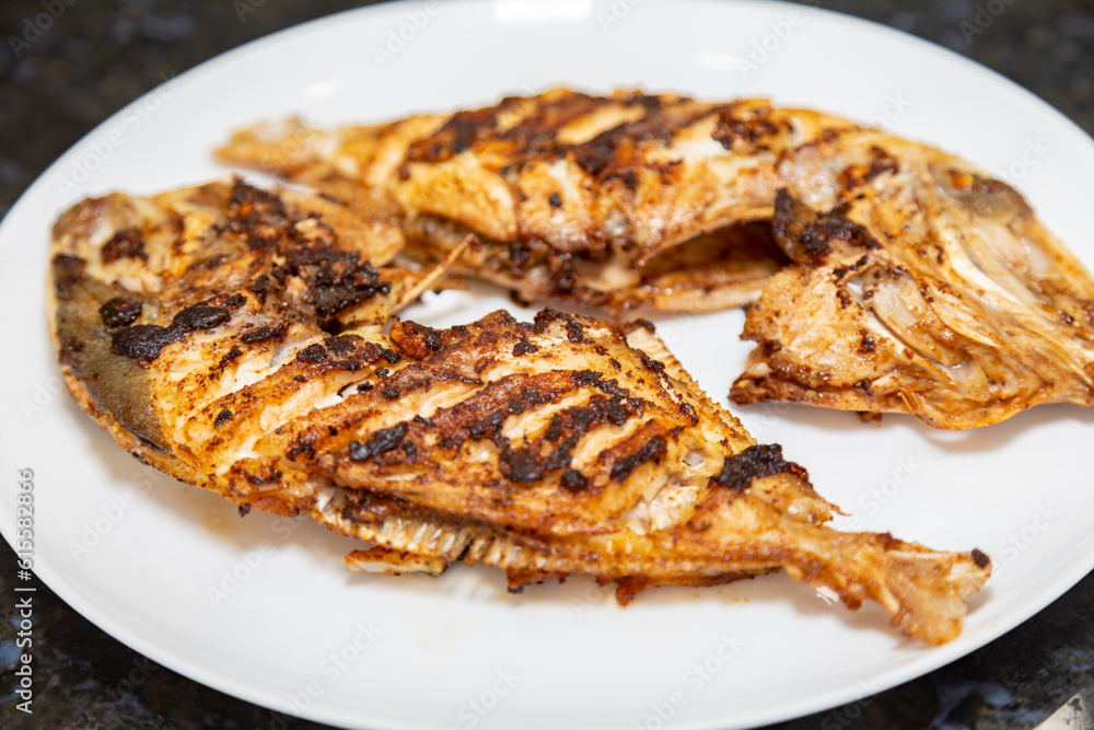 Clean and seasoned Peroá fish (Balistes capriscus) . Typical fish from ...