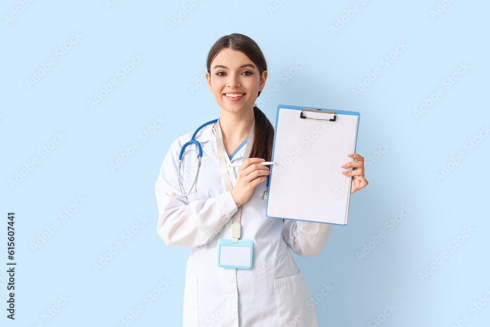 Female doctor on blue background Stock Photo | Adobe Stock