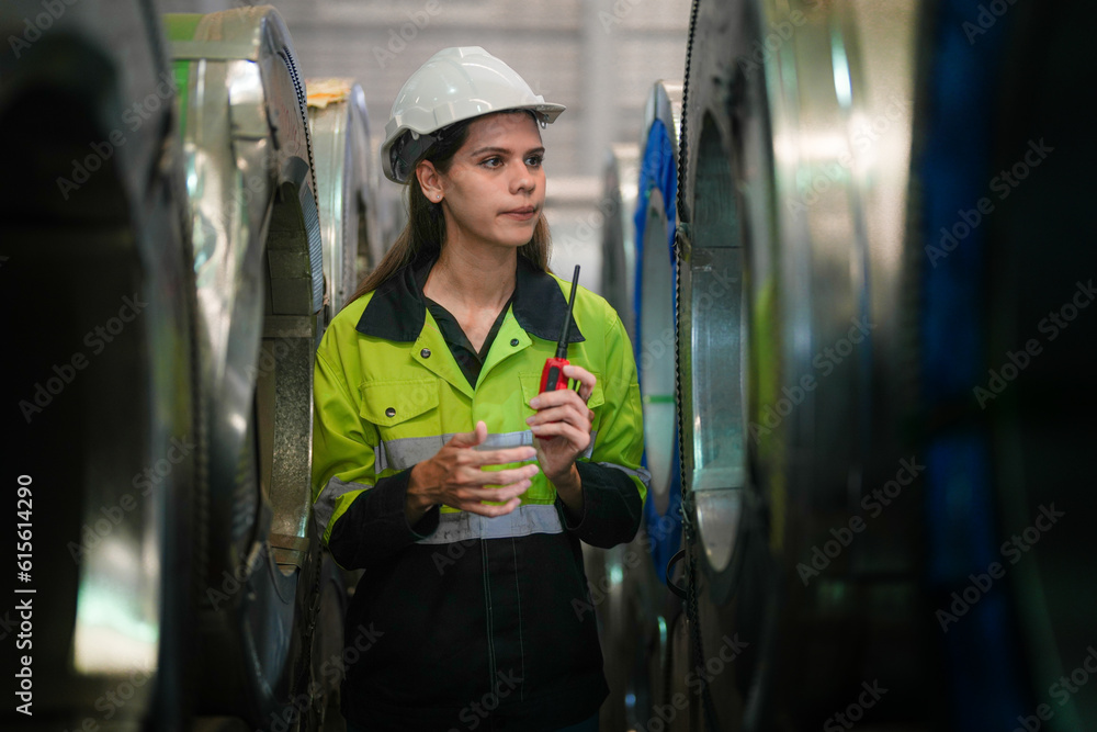 engineer woman standing with confidence with green working suite dress ...
