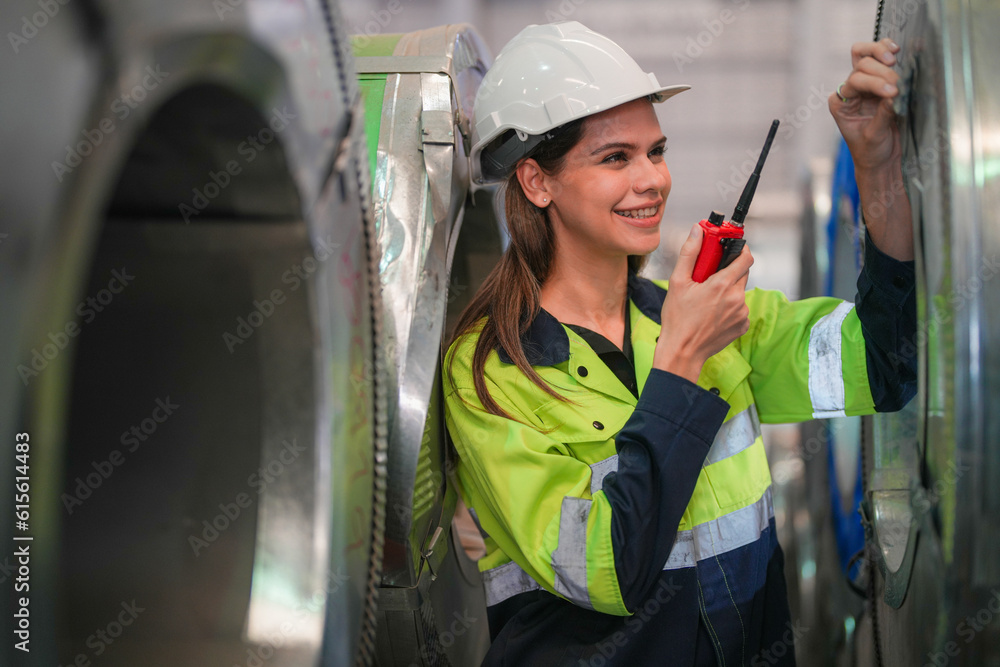 engineer woman standing with confidence with green working suite dress ...