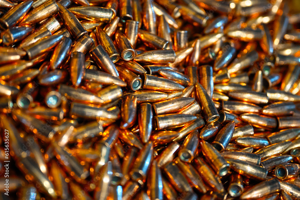 Copper bullet pile for riffle as background Stock Photo | Adobe Stock