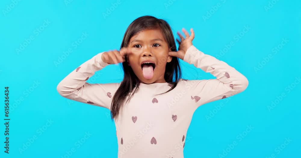 Funny face, tongue out and girl child in studio with crazy, comic and ...
