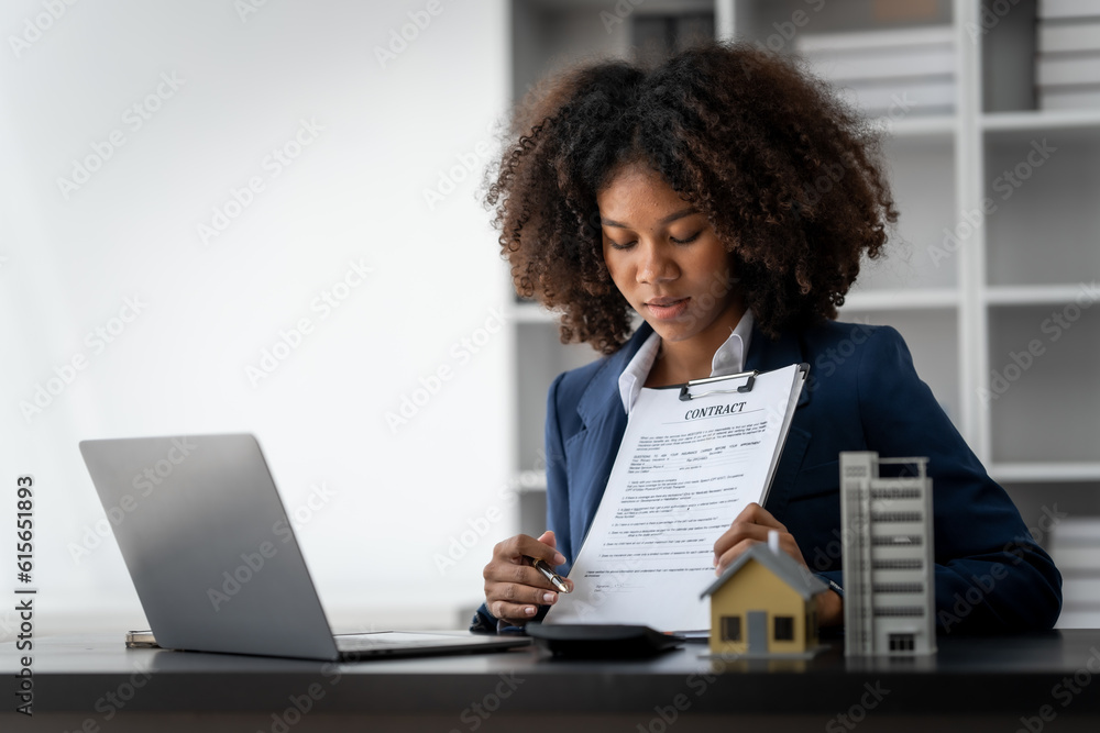 African American realtor working at desk, Housing estate, Vacancy ...