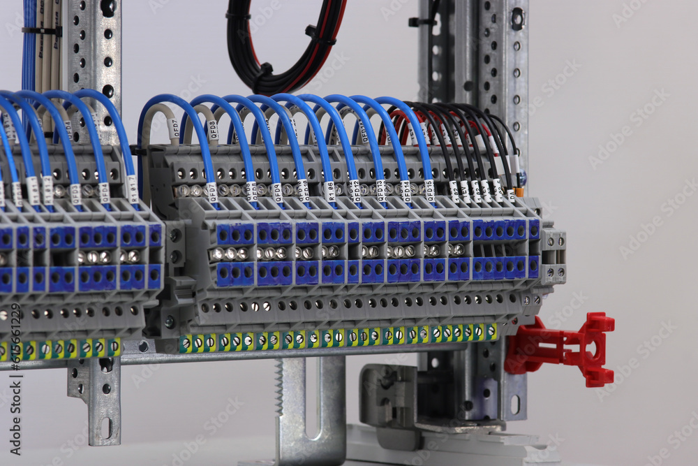 Electrical terminals with connected mounting wires are installed in an ...