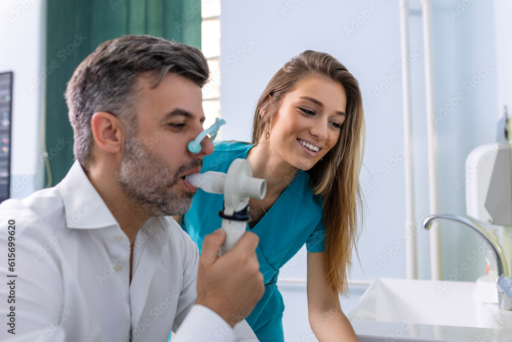 Adult man testing breathing function by spirometry having health ...
