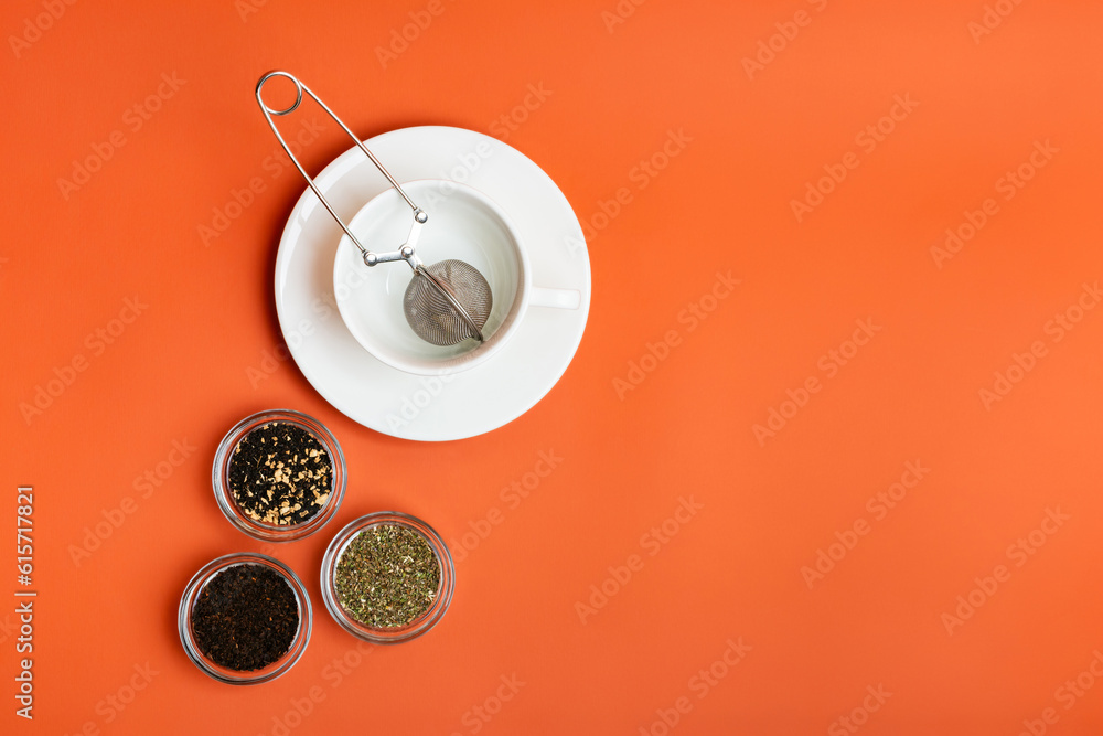 White ceramic plate and empty cup for tea with tea strainer and small ...