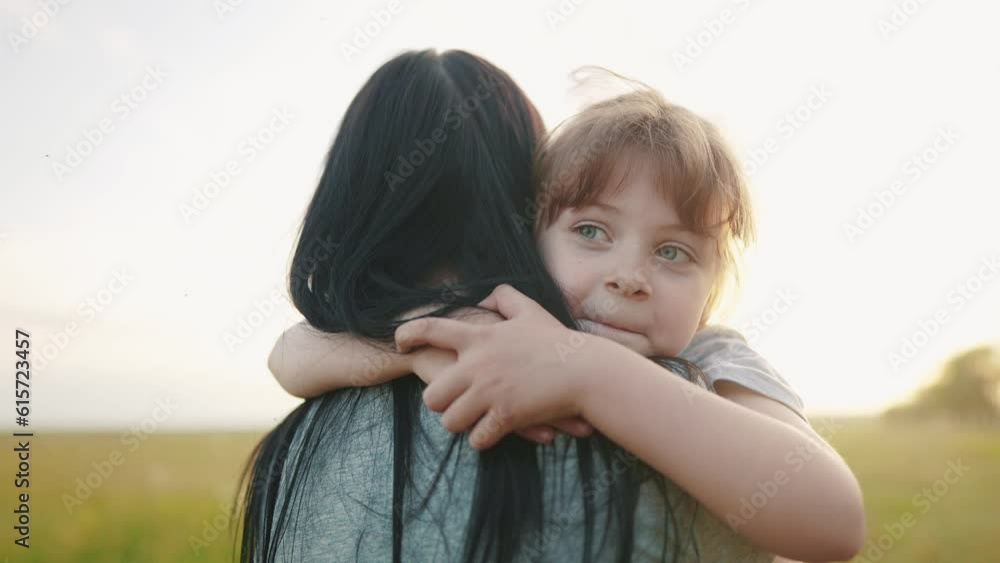 daughter hugging mom. happy family a kid dream concept. mother carries ...