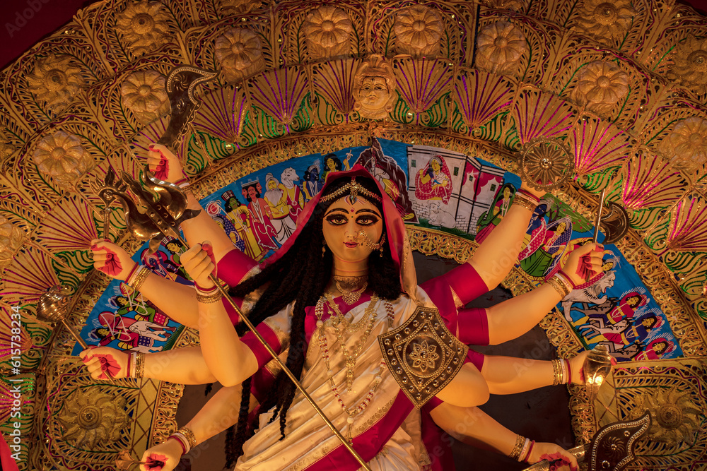 A close up on the beautiful face of an idol of Goddess Durga, symbol of ...