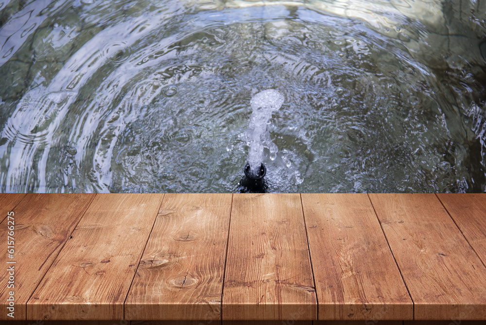 wooden table background with splashing water for displaying products ...