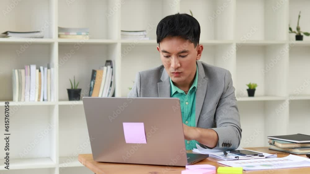 Man sitting in company office, start-up worker working hard, his body ...