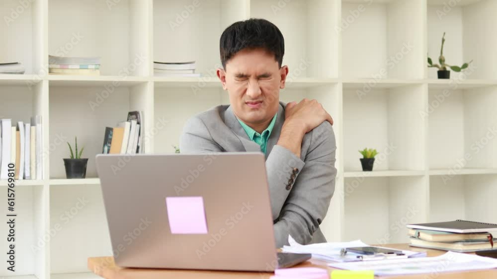 Man sitting in company office, start-up worker working hard, his body ...