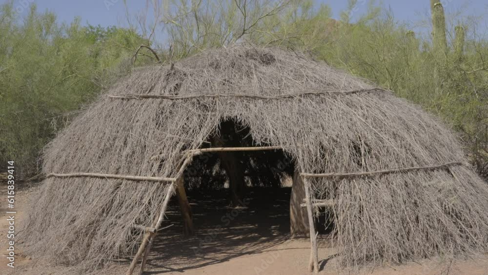 This video shows a front view of an ancient Native American manmade hut ...