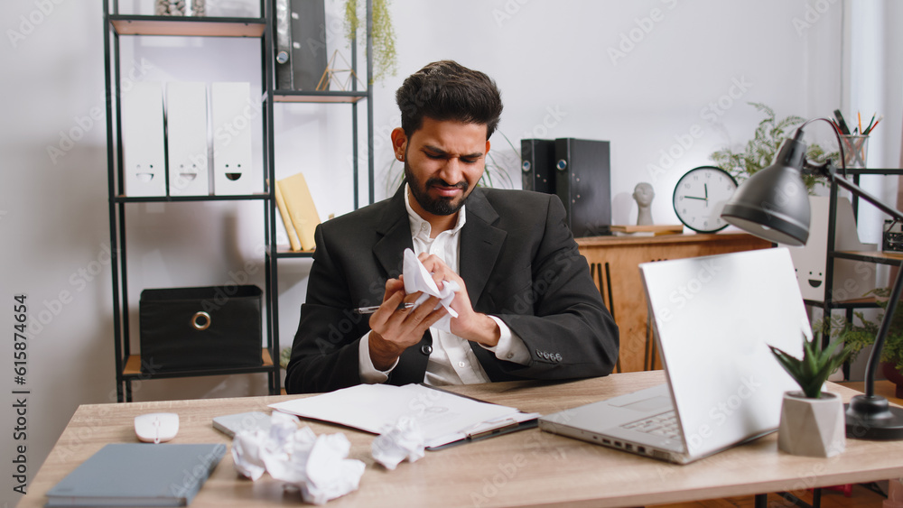 Angry furious indian man working at office throwing crumpled paper ...