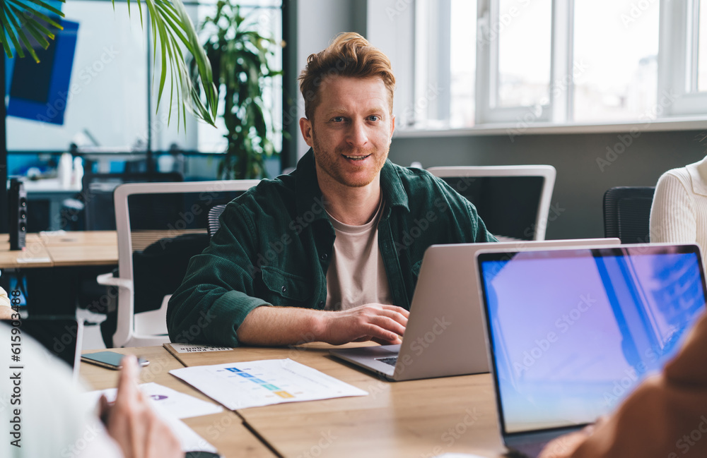 Foto de Caucasian male IT professional with modern laptop computer ...