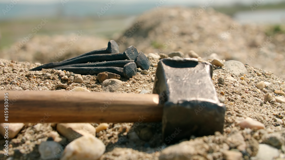 Hammer and nails placed on the ground for the crucifixion of Jesus ...