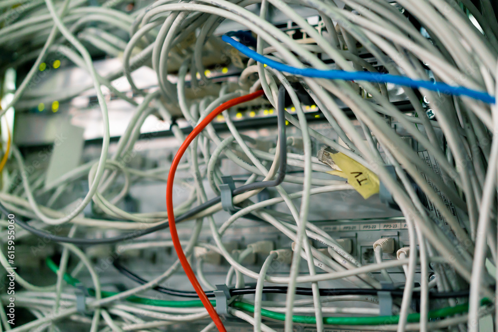a bunch of patch network cables sorted in a rack cabinet leading from a ... a bunch of patch network cables sorted in a rack cabinet leading from a ...