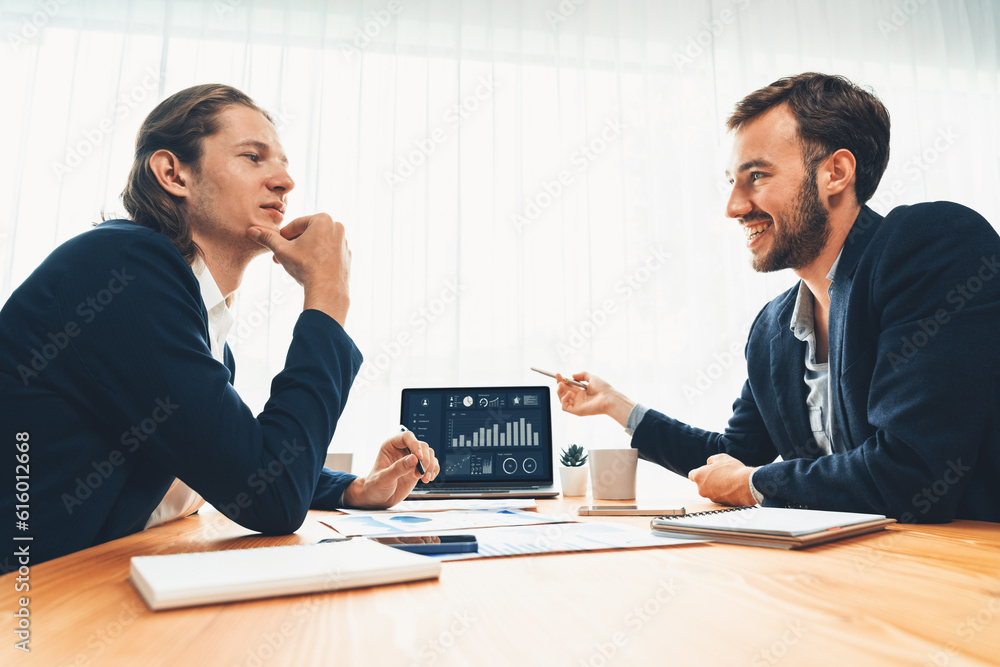Foto de Busy analyst team in office analyzing financial data analysis ...