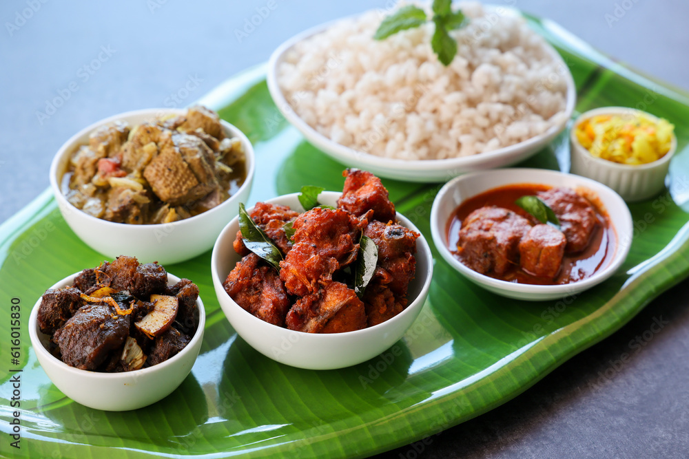 Kerala special food sadhya in banana leaf plate with Chicken fry Duck ...